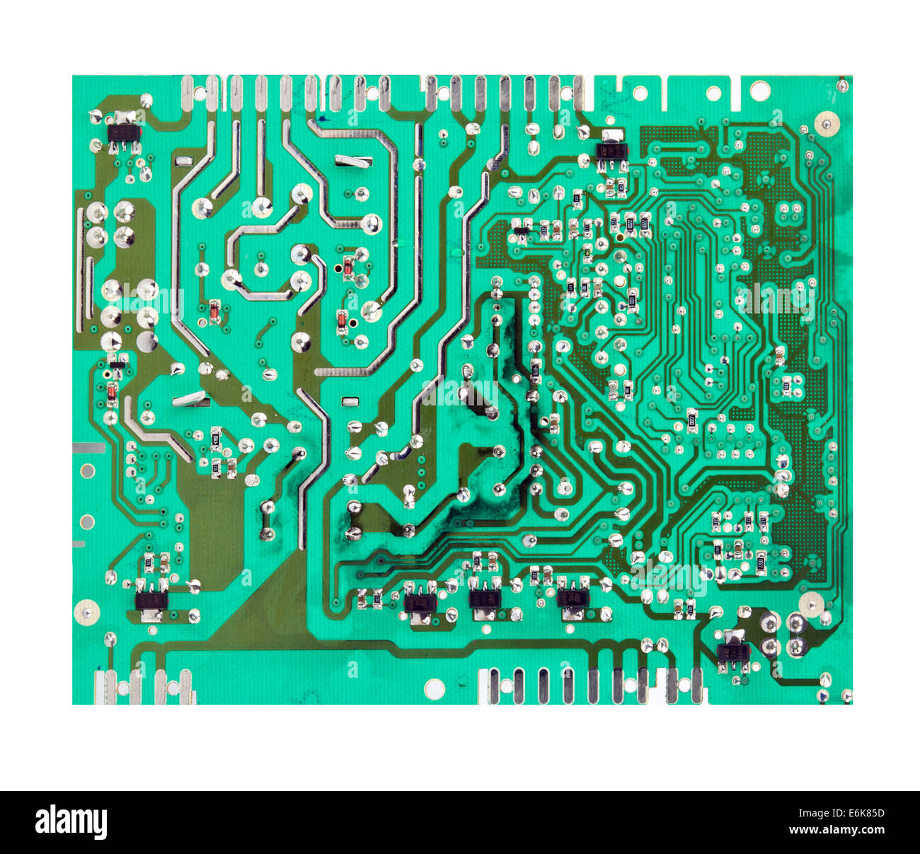 green electrical circuit board with conductors and transistors ...