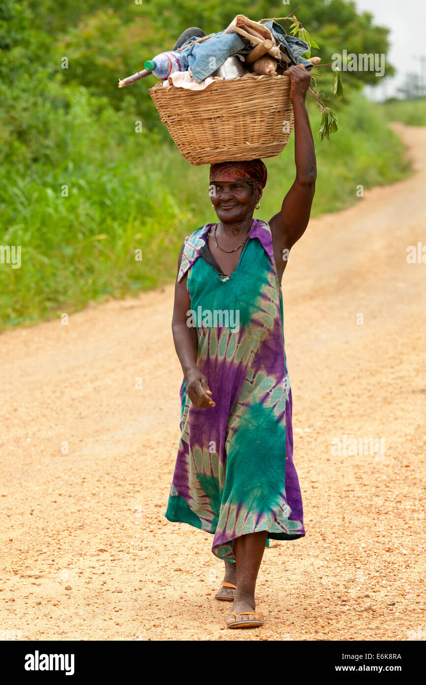 Hawker carrying goods on head, rural Ghana, Africa Stock Photo - Alamy