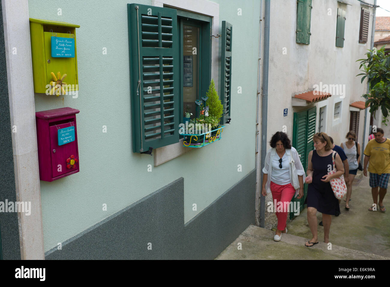 Decorated post boxes and houses in the labyrinth of passages in Mali ...