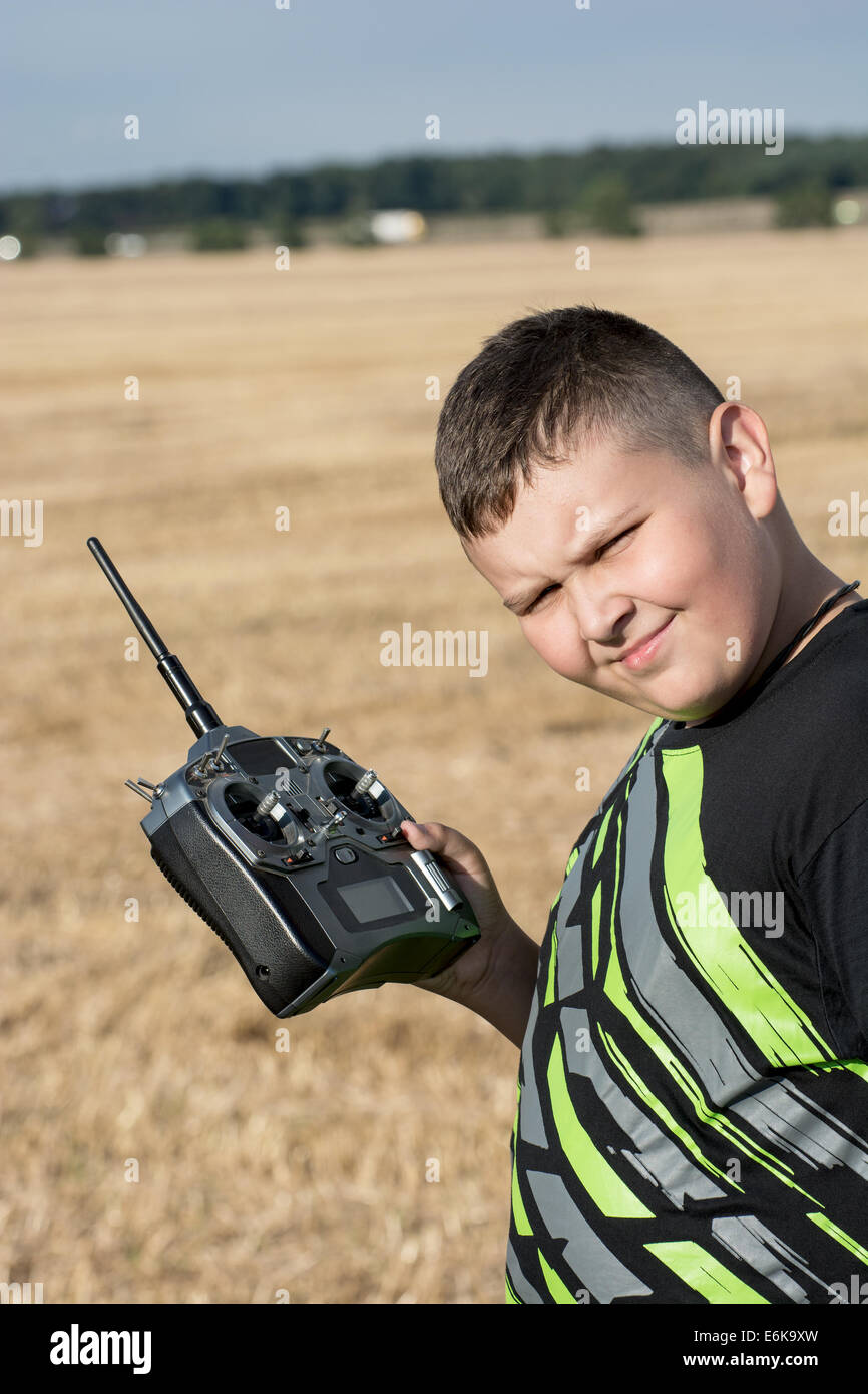 young boy with radio control. Playing with RC airplane Stock Photo - Alamy