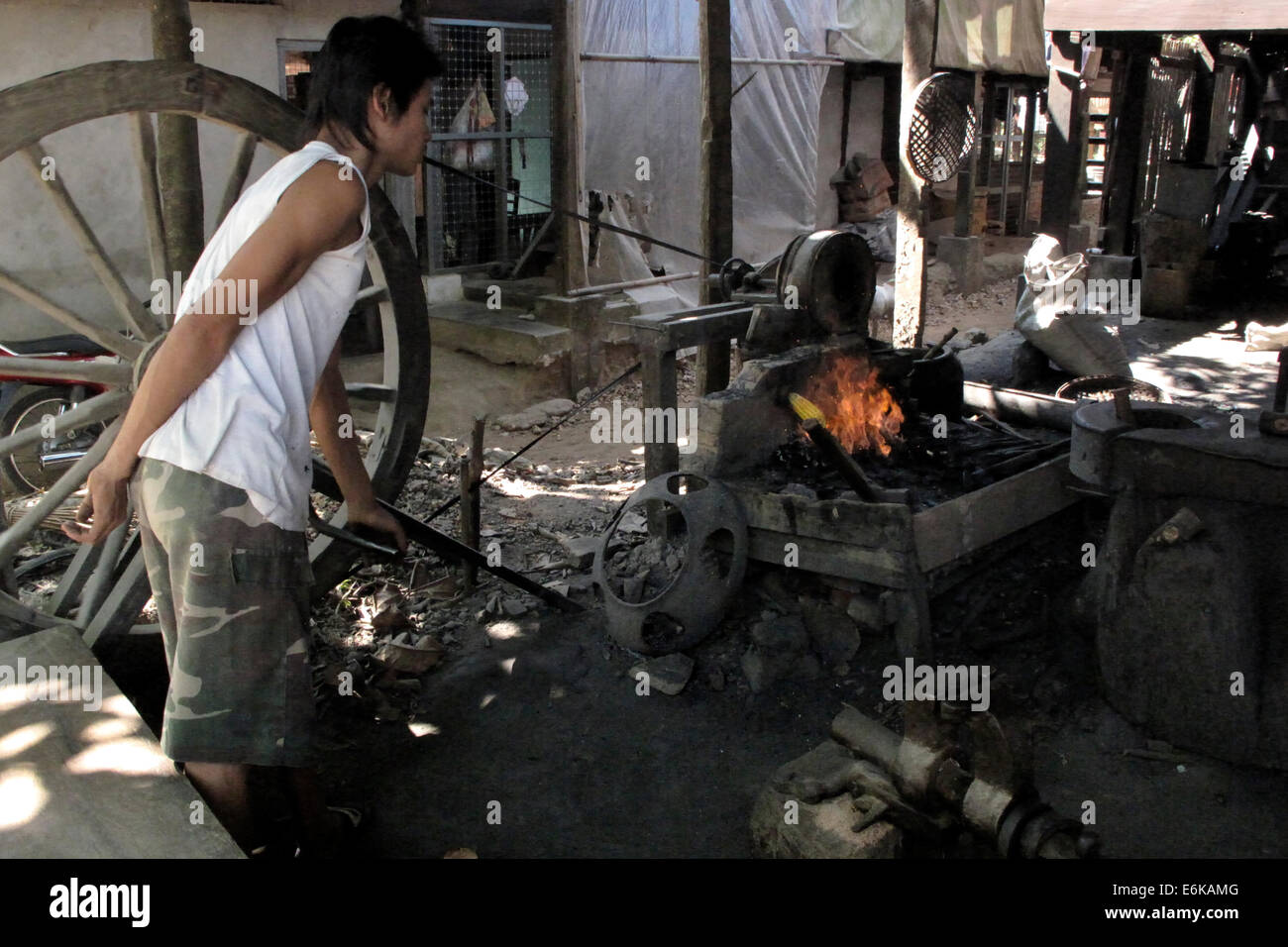 Man working at the forge and anvil ,fire,working for living,food Stock ...