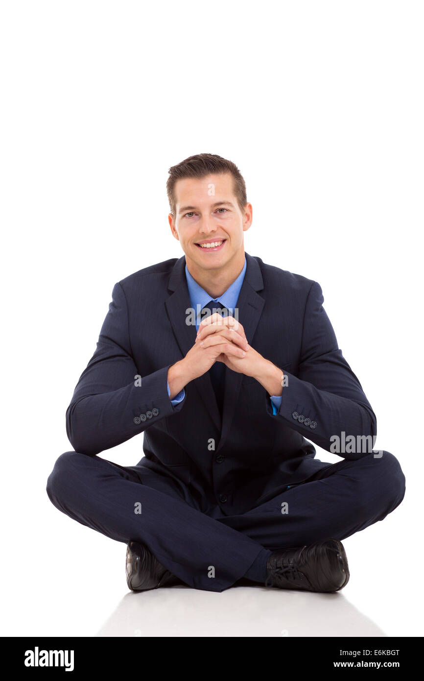 good looking businessman relaxing on floor isolated on white Stock ...