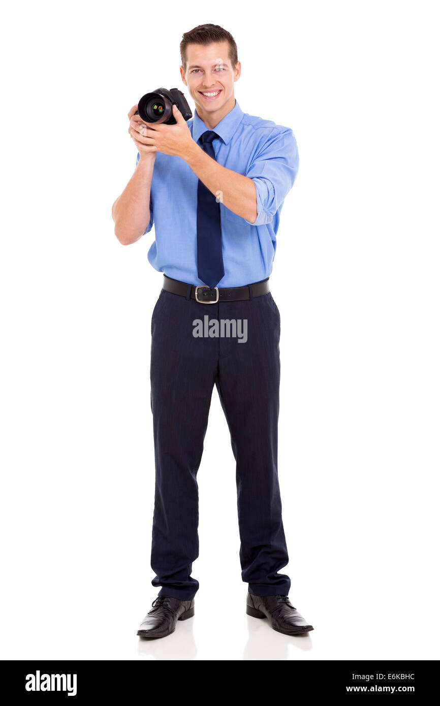 young photographer holding a camera in studio Stock Photo - Alamy