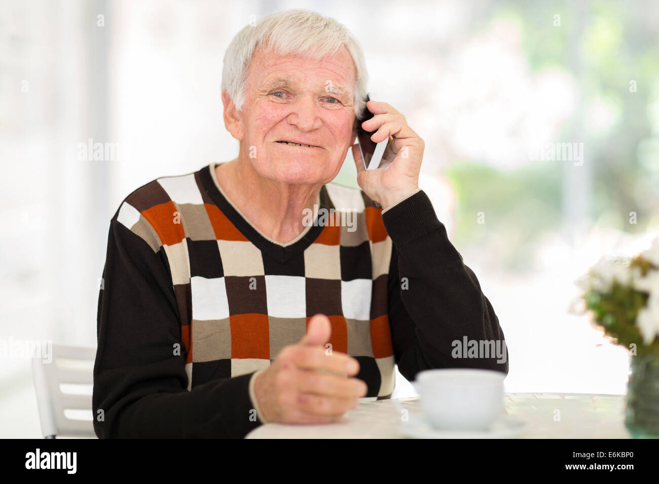 cheerful senior man talking on cell phone at home Stock Photo - Alamy