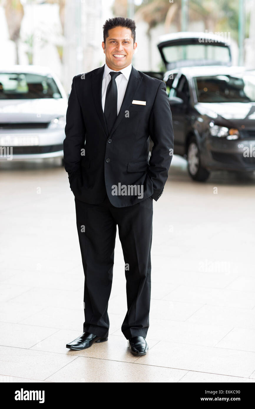 young vehicle dealership principal inside showroom Stock Photo - Alamy