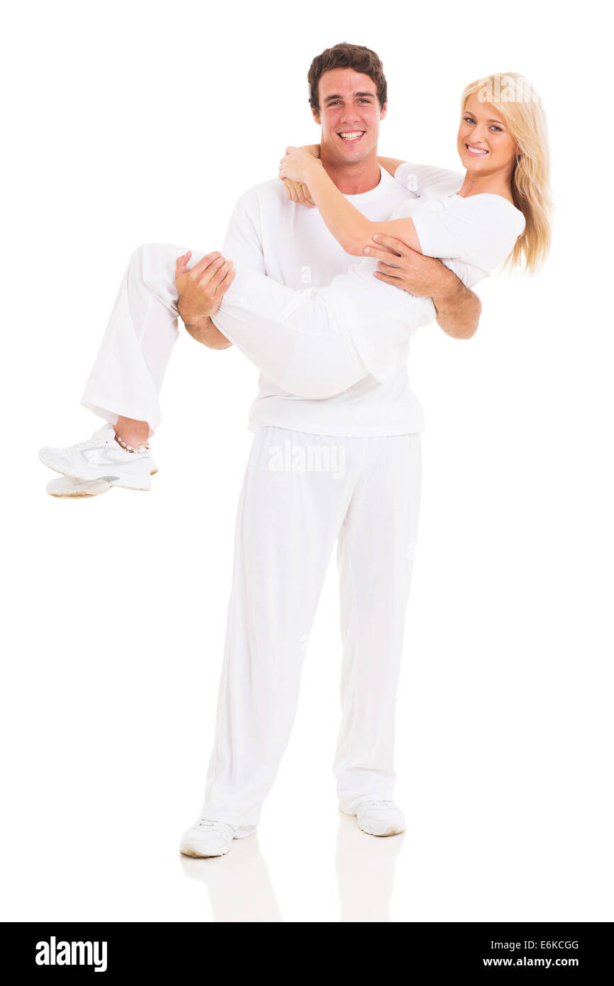 happy man carrying girlfriend in his arms on white background Stock ...
