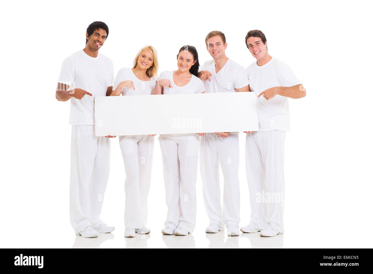 group of happy friends pointing blank white board isolated on white ...
