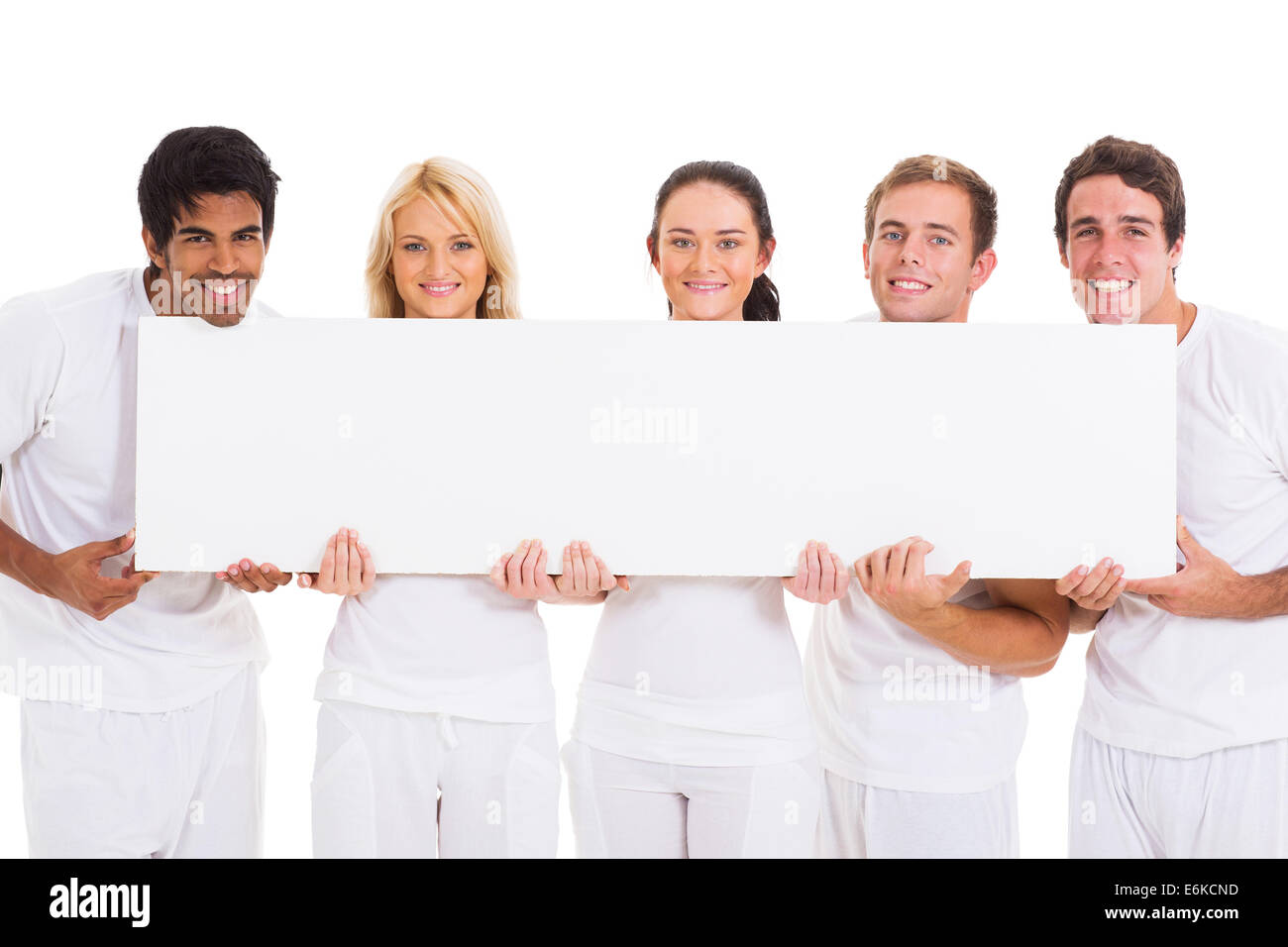 group of happy friends holding blank banner over white background Stock ...