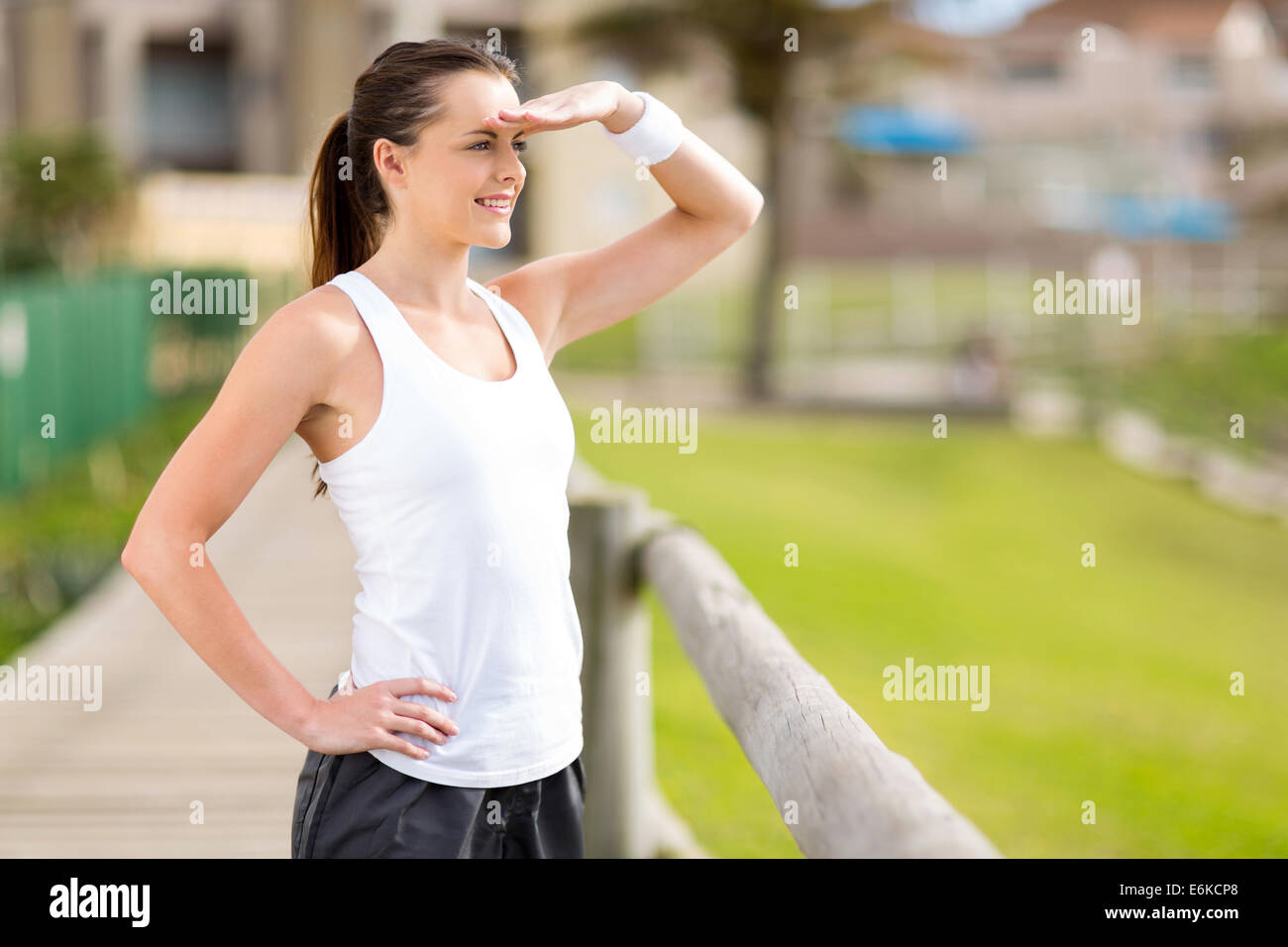 beautiful young exercise woman outdoors and looking into distance Stock ...