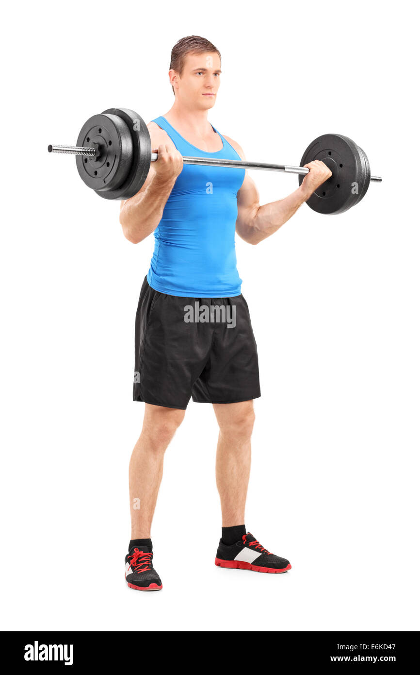 Full length portrait of a muscular bodybuilder lifting a barbell ...