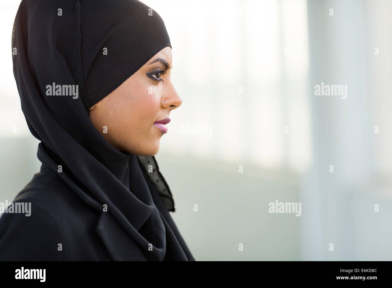 side view of young Arabian businesswoman indoors Stock Photo - Alamy