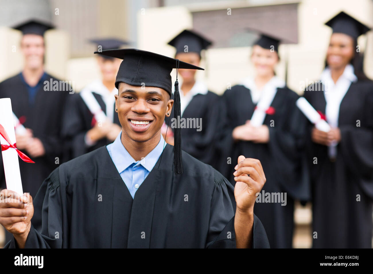happy African American male college graduate at ceremony Stock Photo ...