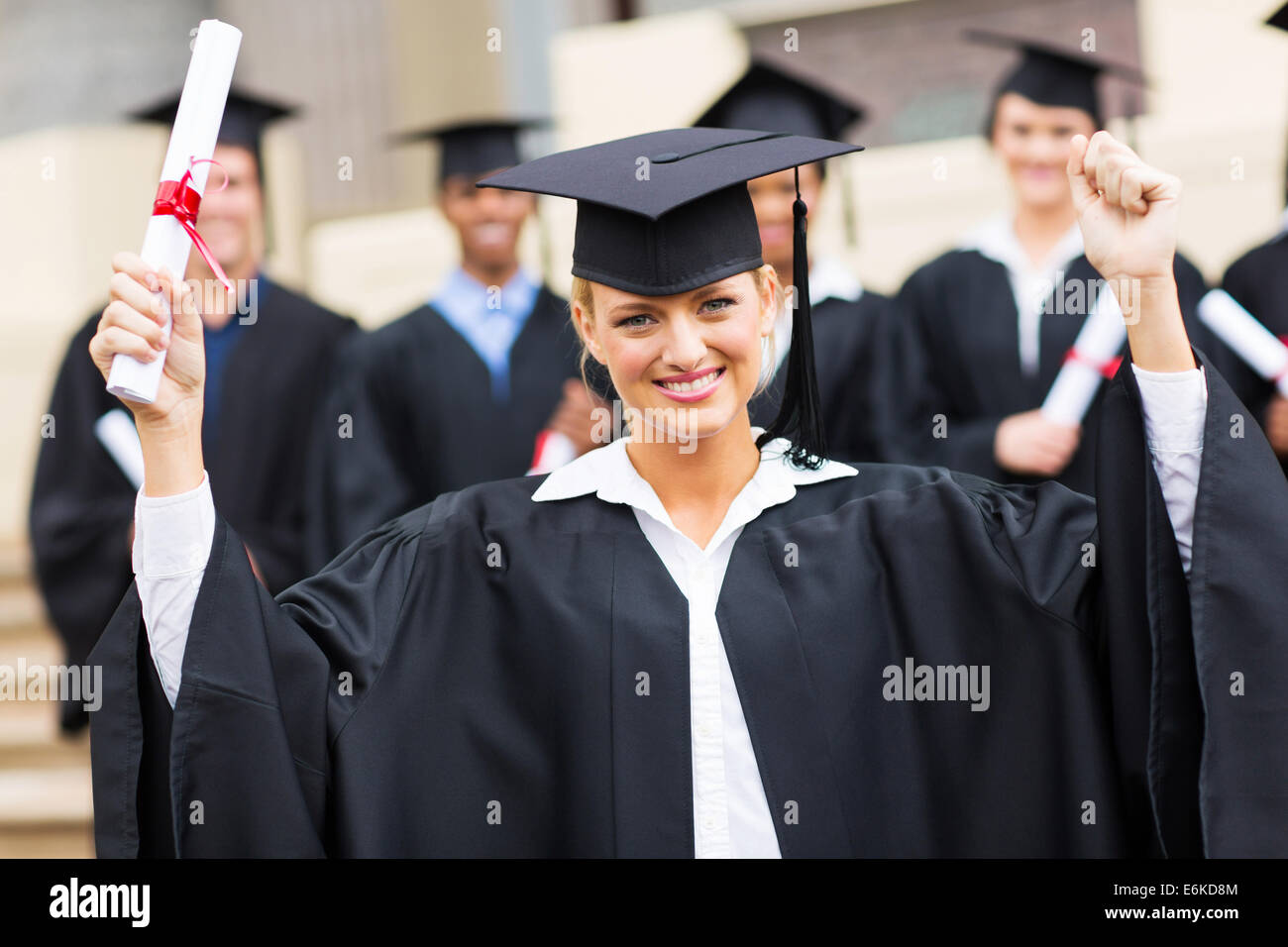excited female university graduate holding her certificate Stock Photo ...