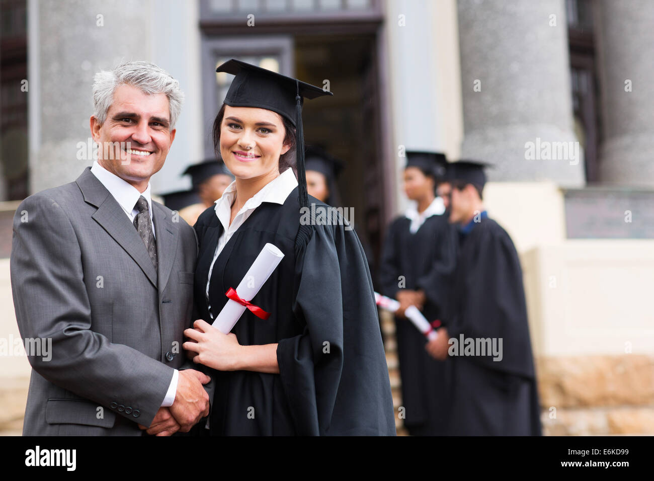 pretty female graduate with her father at university graduation Stock ...