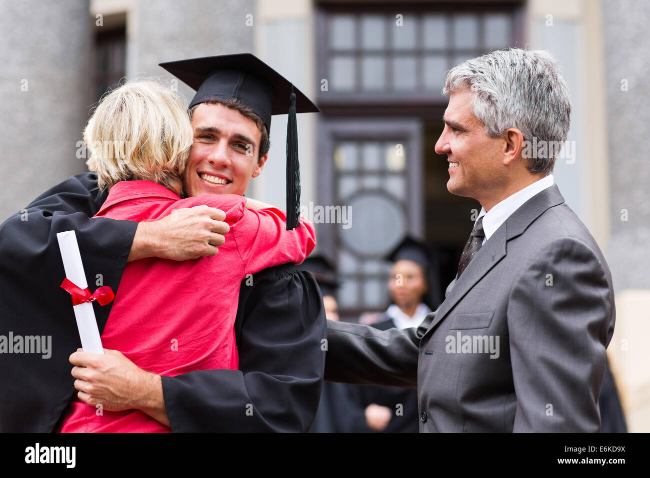 happy male graduate hugging his mother at graduation ceremony Stock ...