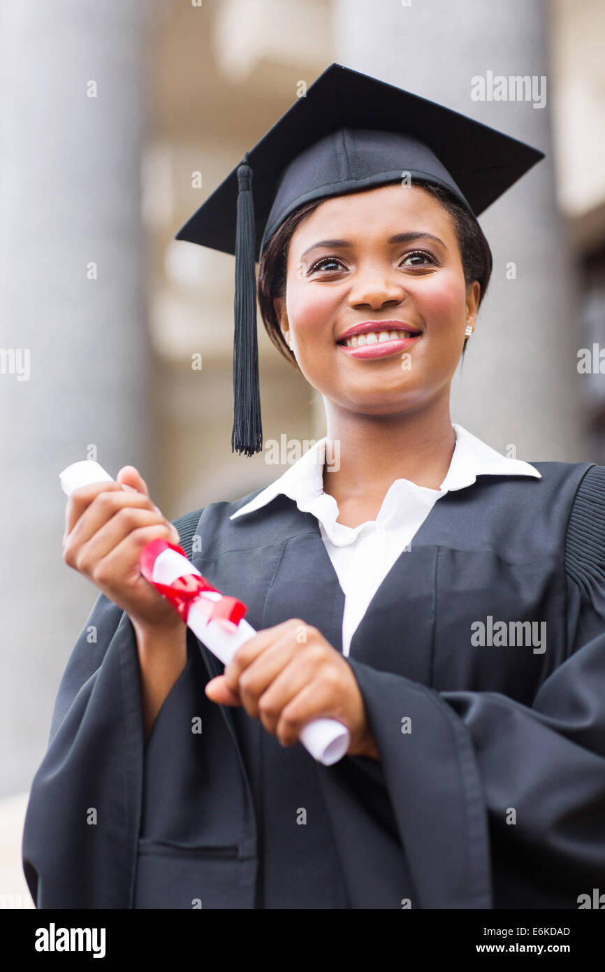 Pretty african university graduate holding hi-res stock photography and ...