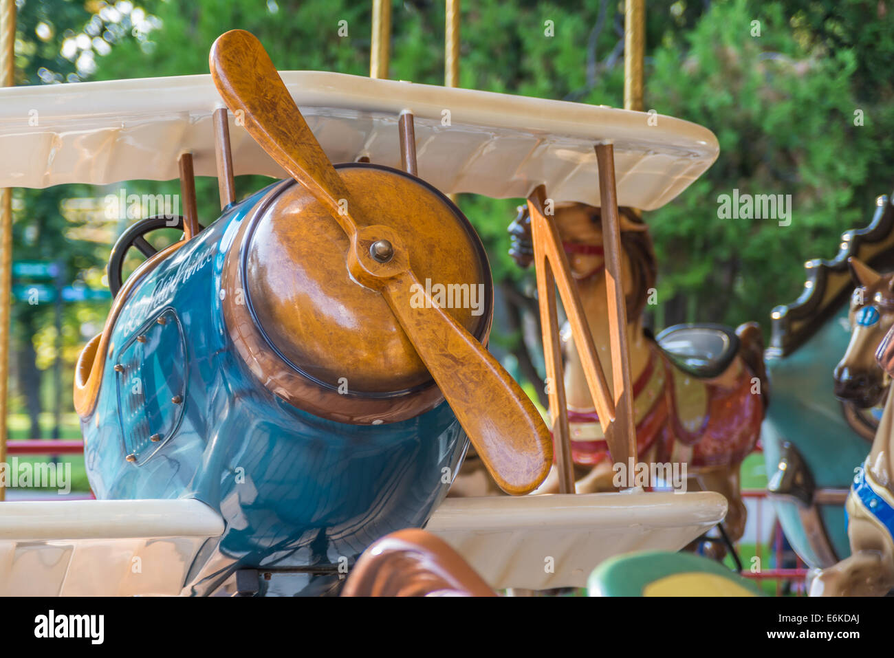 A nice carousel particular of a blue airplane Stock Photo - Alamy