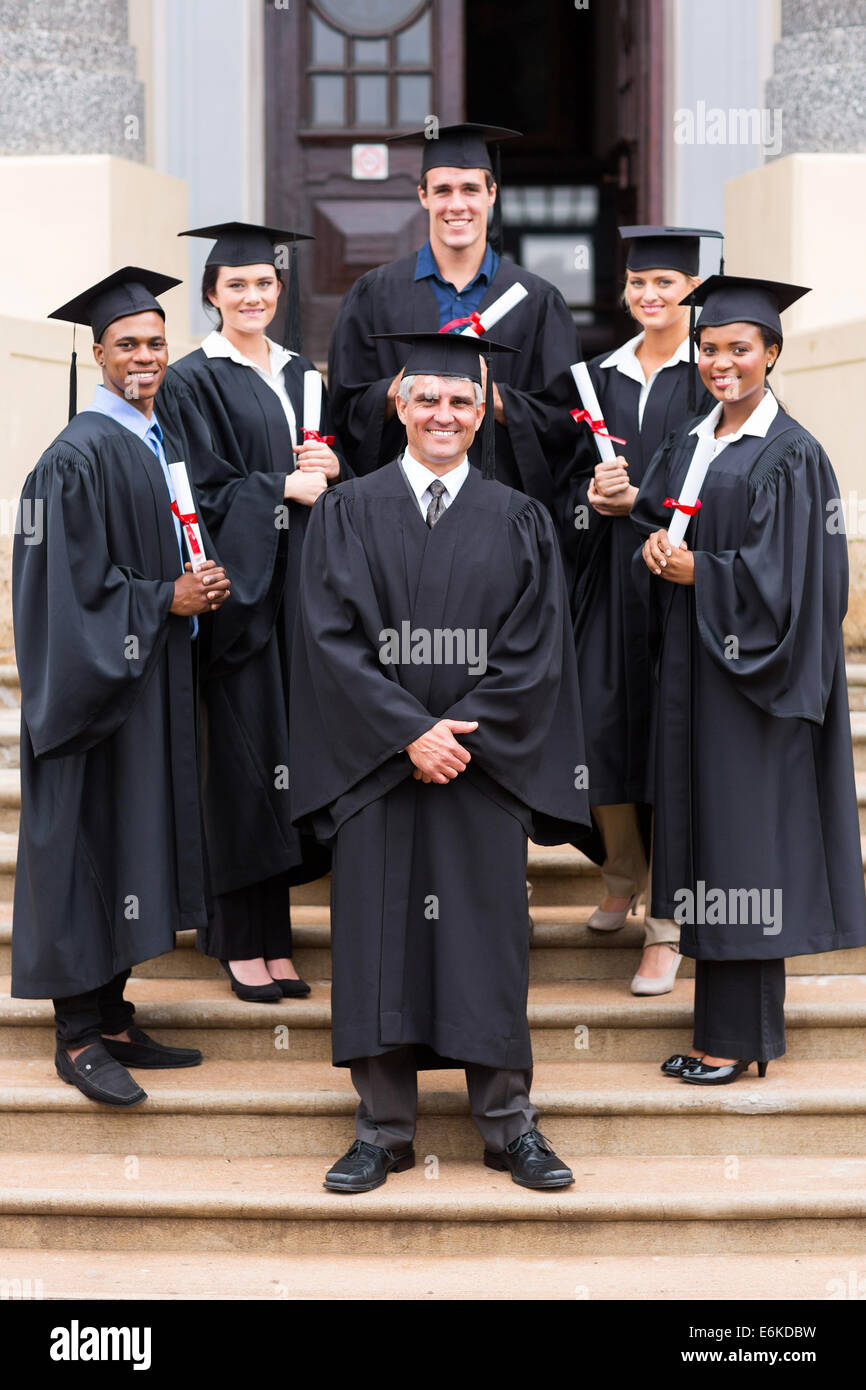 happy university professor and group of graduates at graduation ...