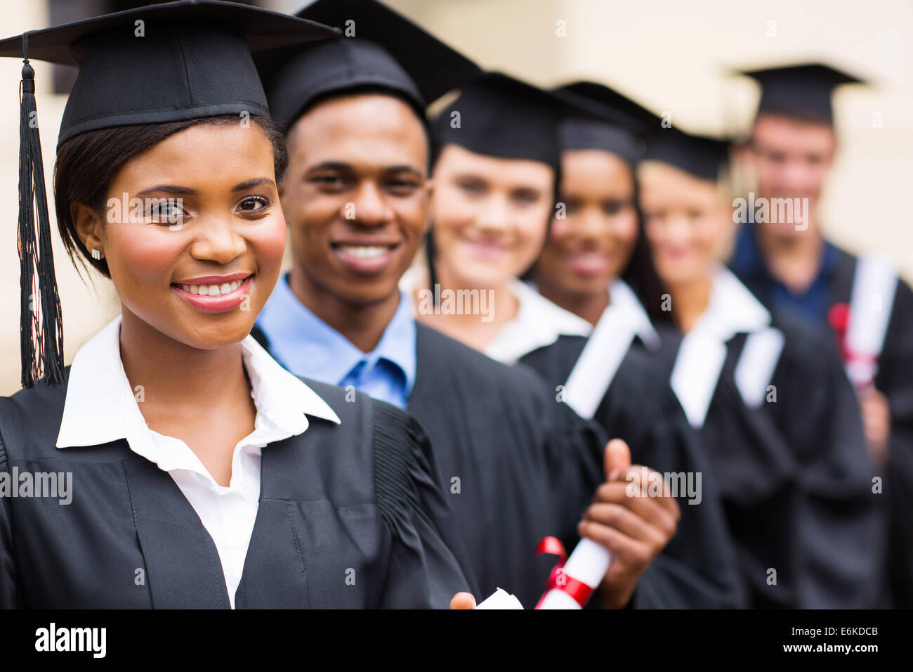 group of multicultural university graduates standing in a row Stock ...