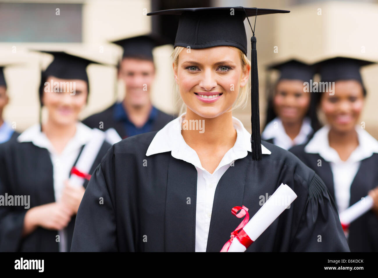 beautiful graduation girl holding her diploma with pride Stock Photo ...