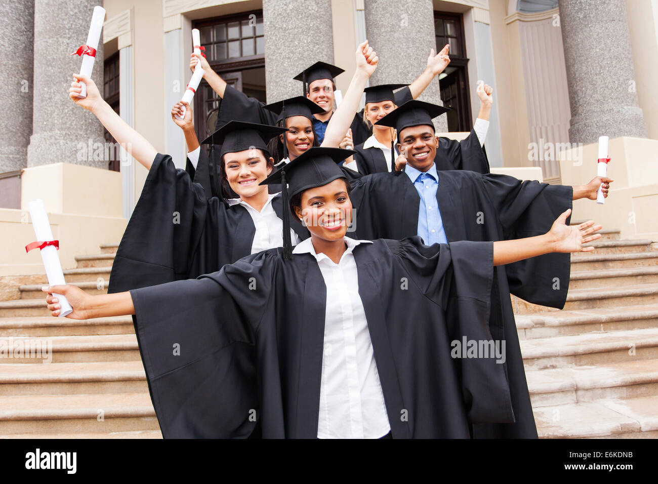 group of happy university students in front of university building ...