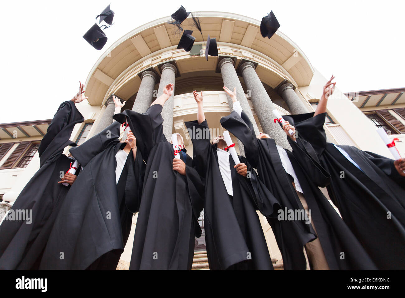 Students throwing caps in the air hi-res stock photography and images ...