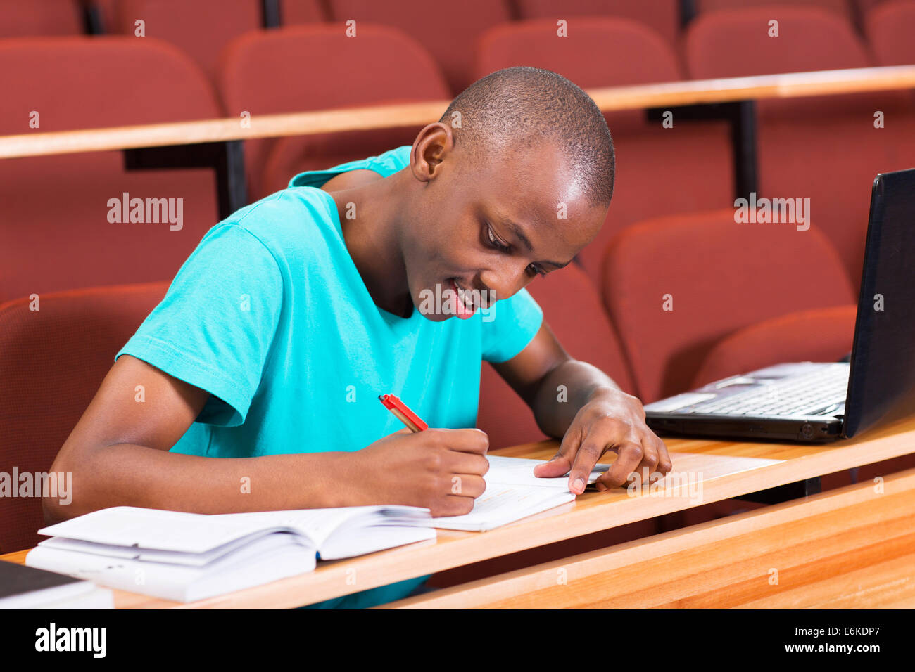 handsome male African college student writing classwork Stock Photo - Alamy
