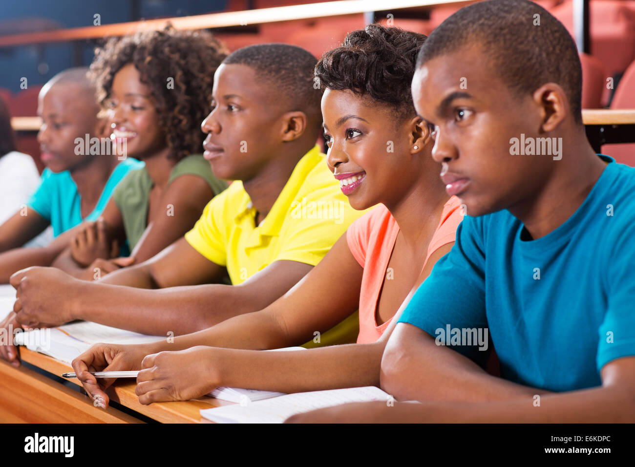 group of African American university students studying in lecture hall ...