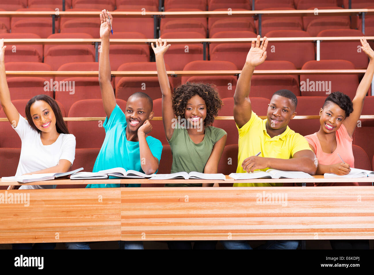 group of African uni students arms up in classroom Stock Photo - Alamy