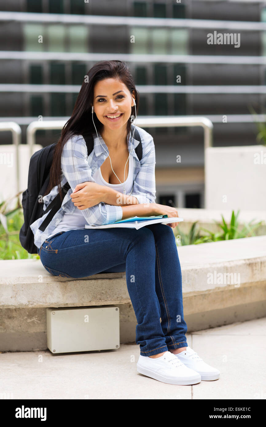 cheerful young college student sitting outside campus building Stock ...