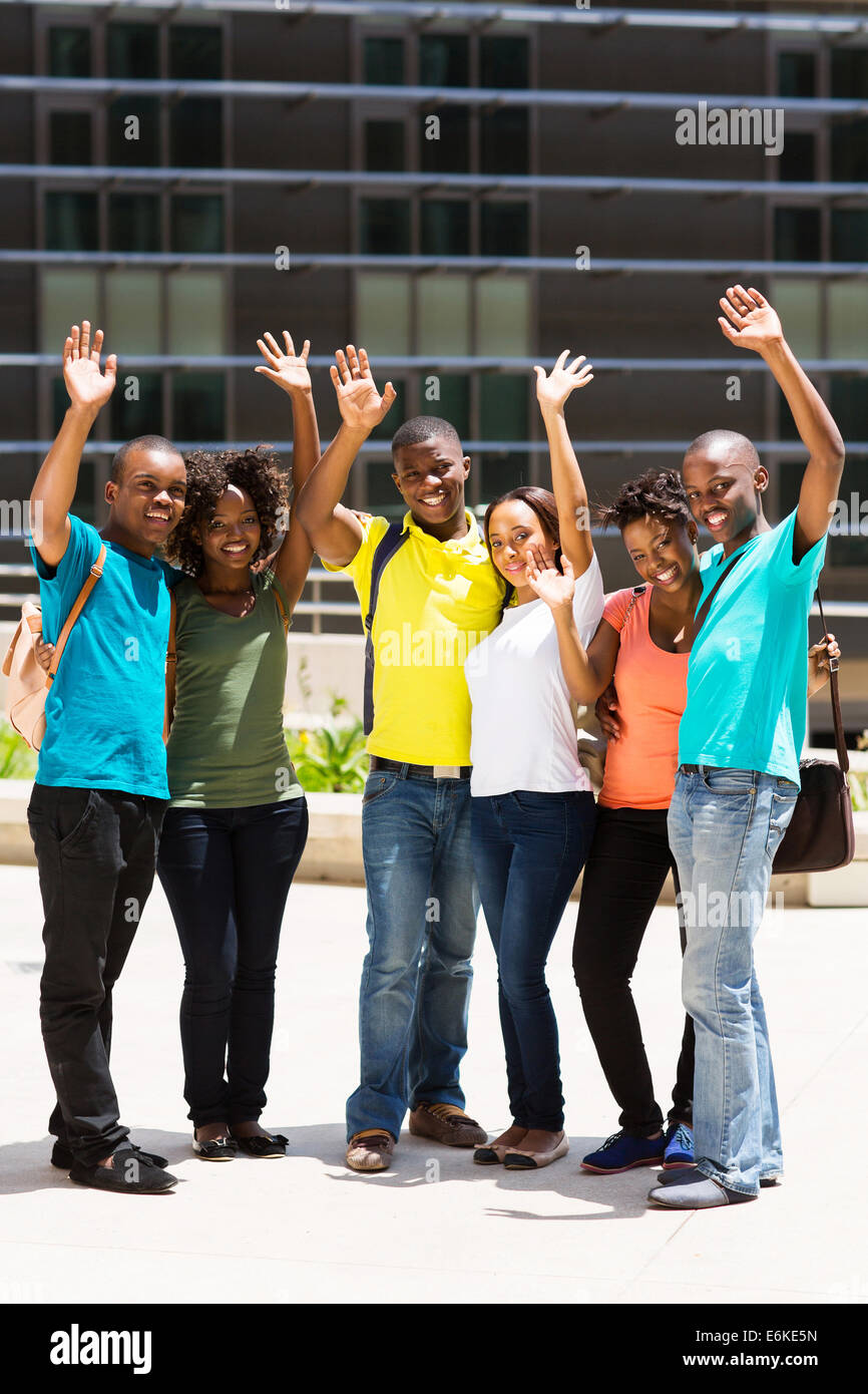 Woman waving at group friends hi-res stock photography and images - Alamy