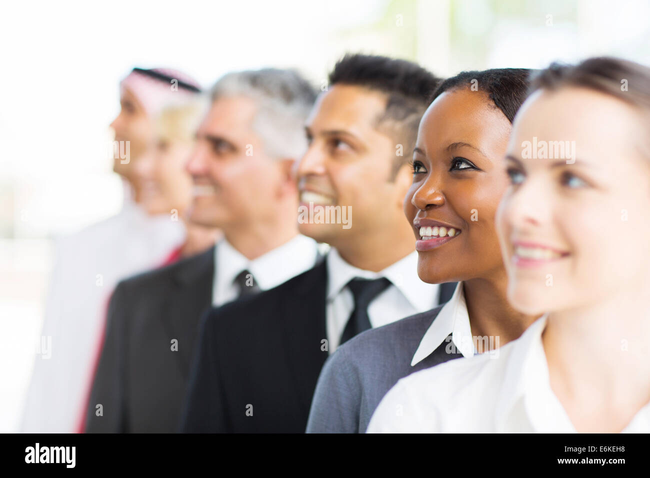 successful business people looking up Stock Photo - Alamy