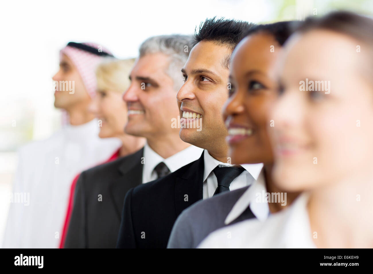 Indian businessman standing in a row with co-workers Stock Photo - Alamy