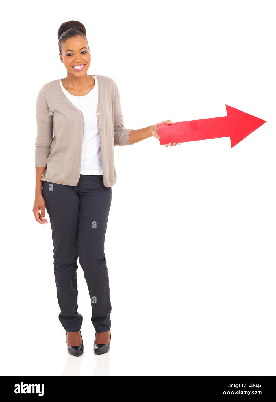 smiling black girl with direction arrow Stock Photo - Alamy