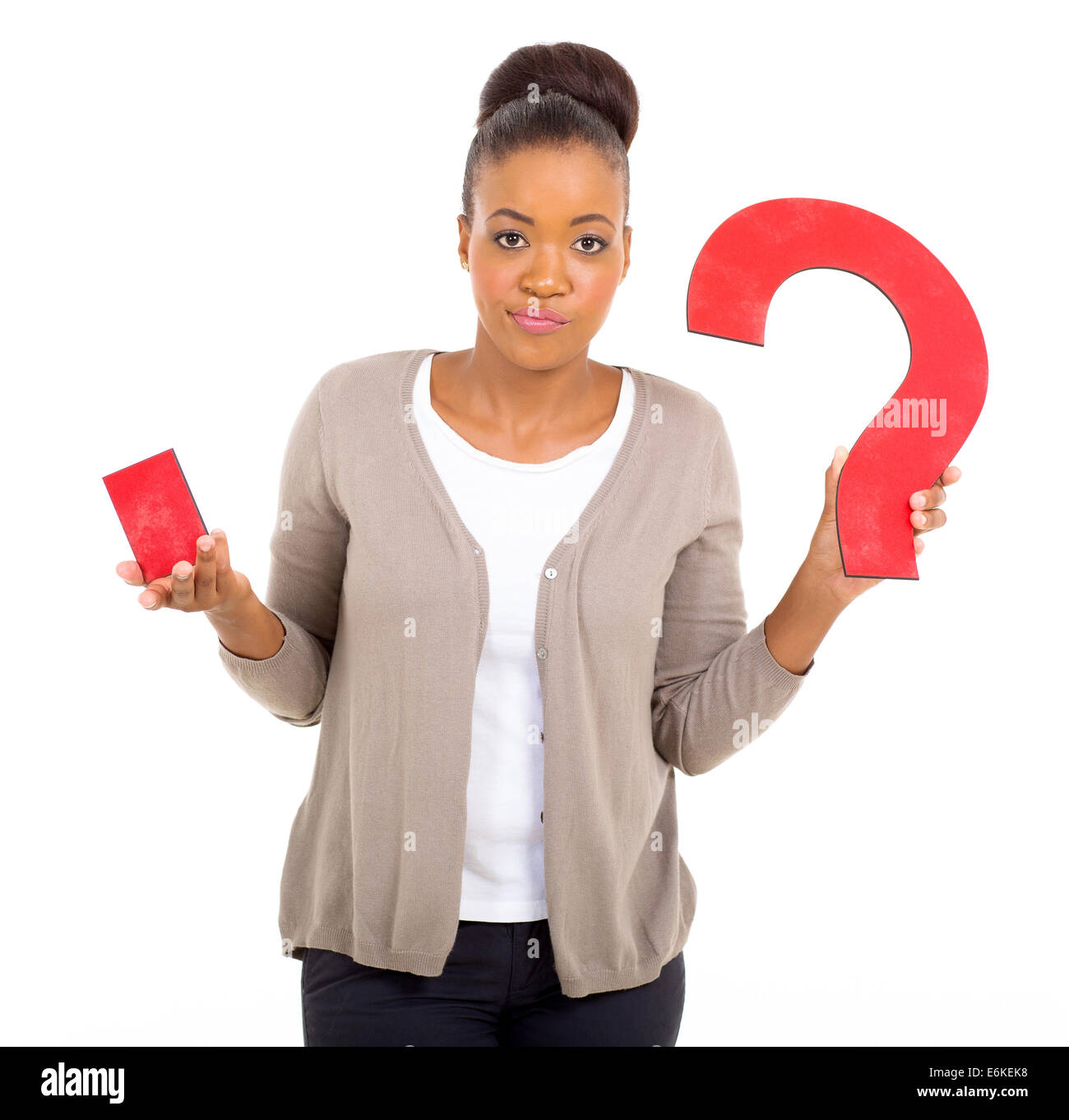 clueless African woman with paper question mark on white background ...