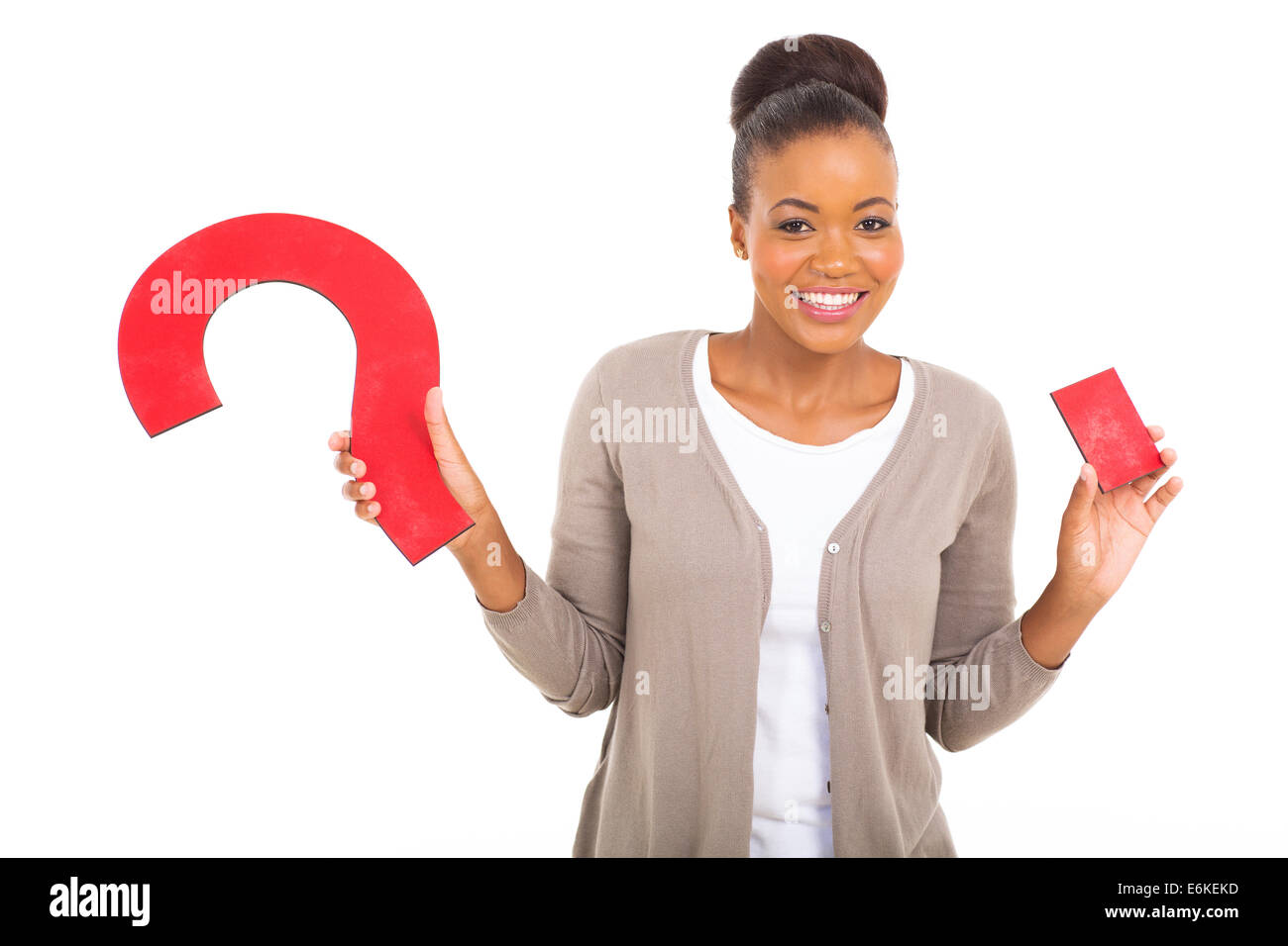 beautiful young African woman holding question mark against white ...