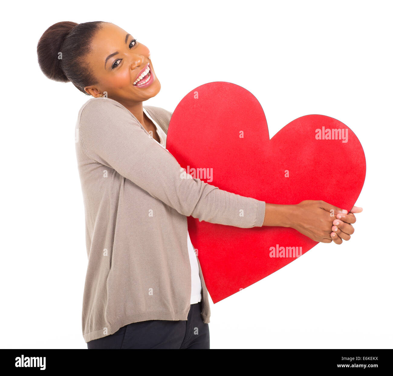 laughing afro American girl holding paper heart shape on white ...