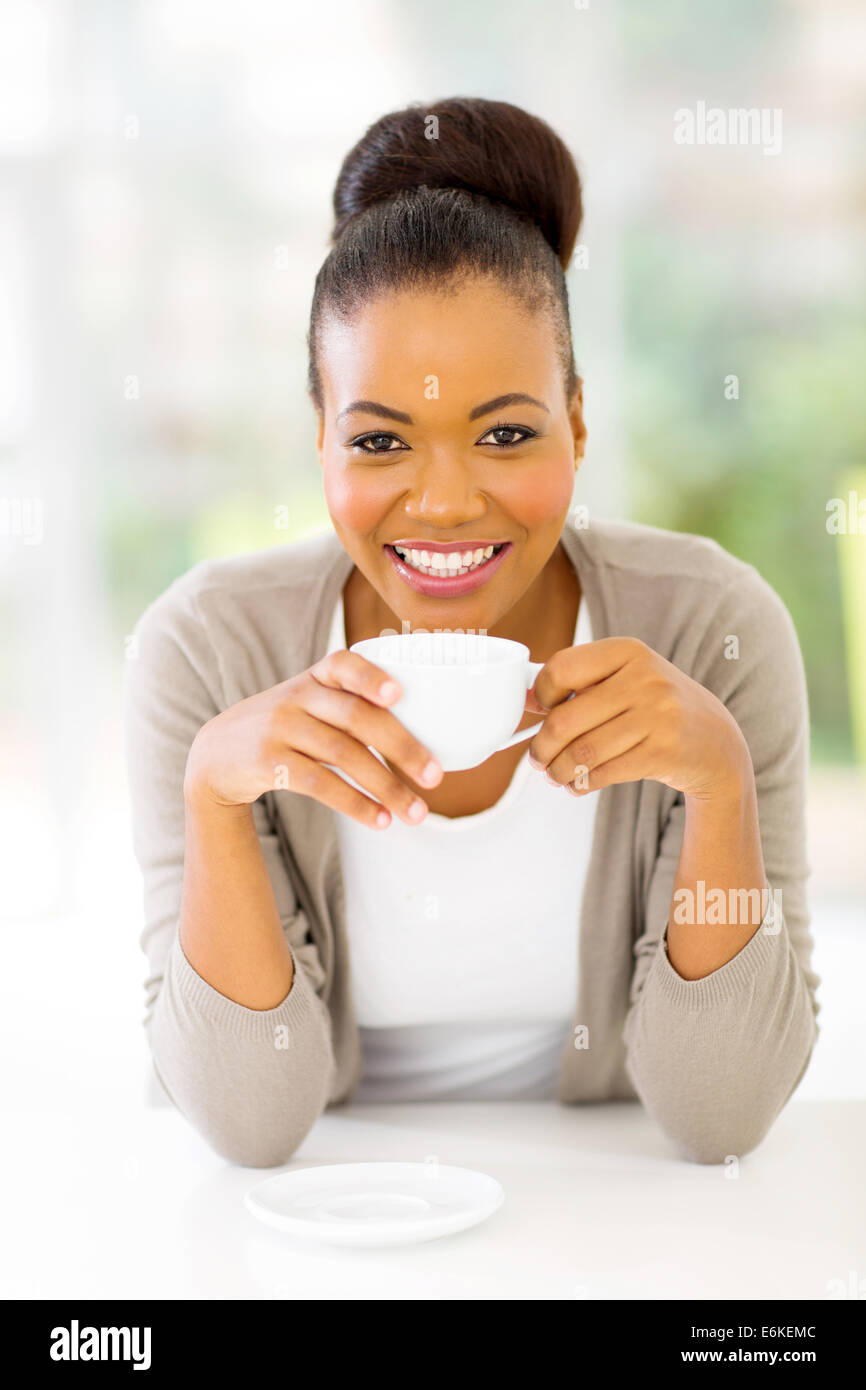 beautiful African American woman drinking coffee at home Stock Photo ...