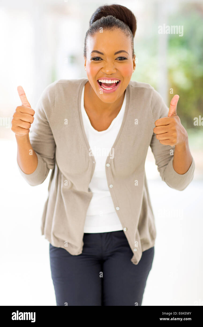 cheerful African woman giving two thumbs up as sign of approval Stock ... cheerful African woman giving two thumbs up as sign of approval Stock ...