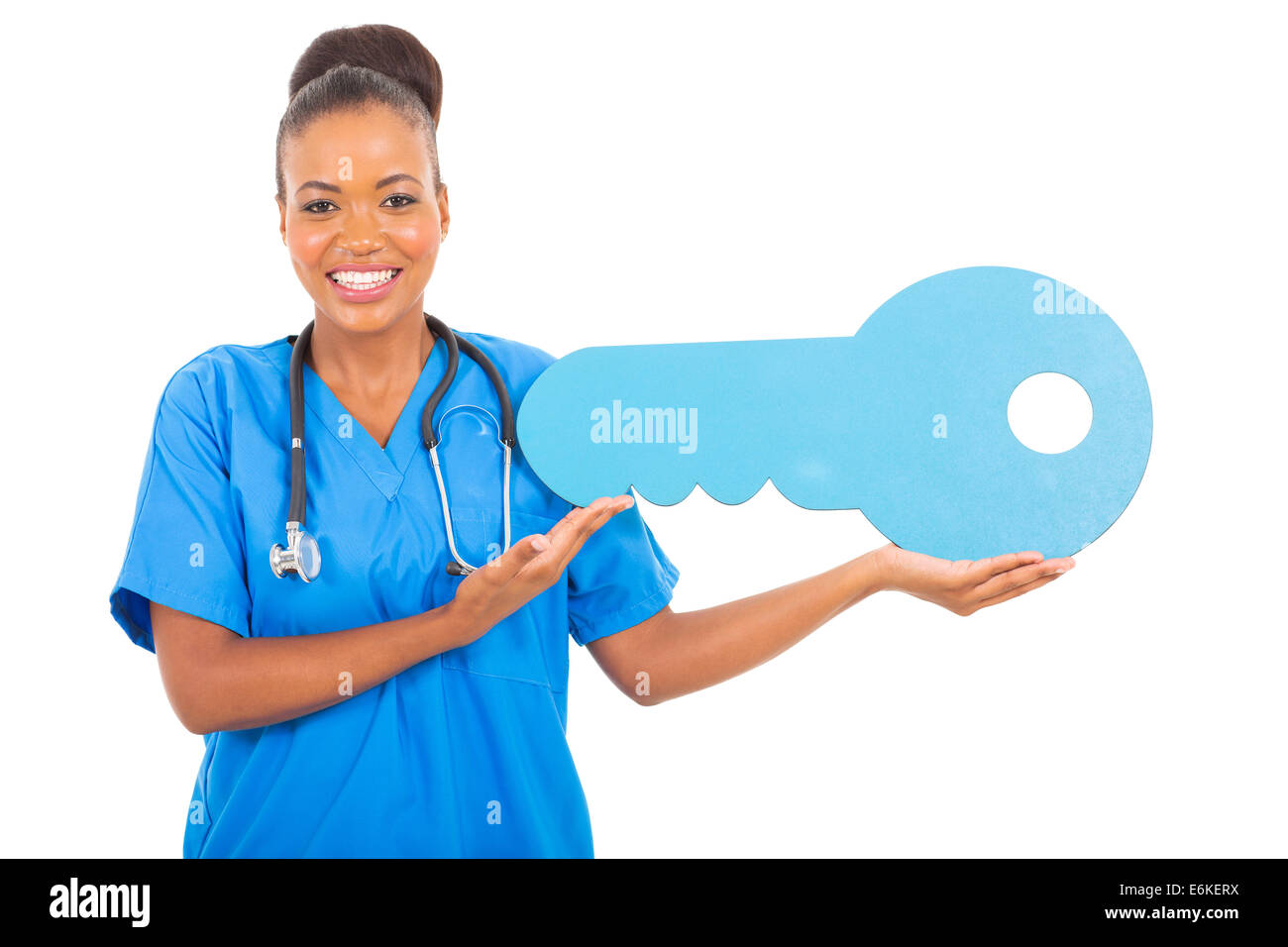 cheerful African medical intern doctor holding a large toy key Stock ...