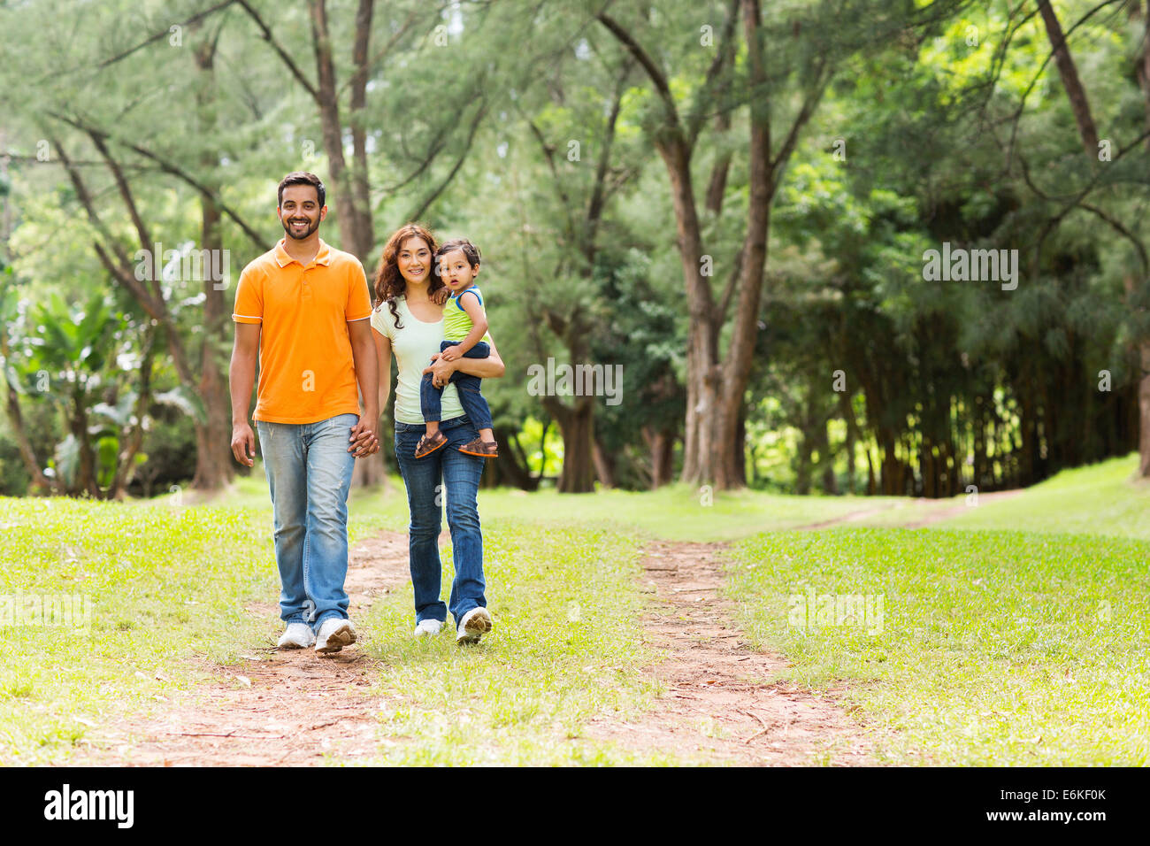 happy young Indian family going for a walk in forest Stock Photo - Alamy