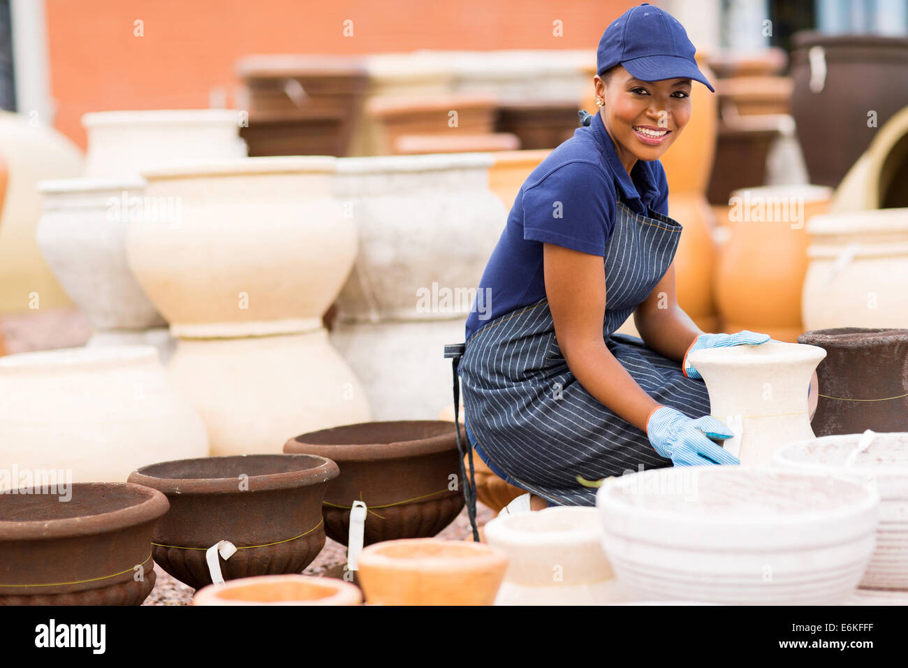 Black female shop worker hi-res stock photography and images - Alamy