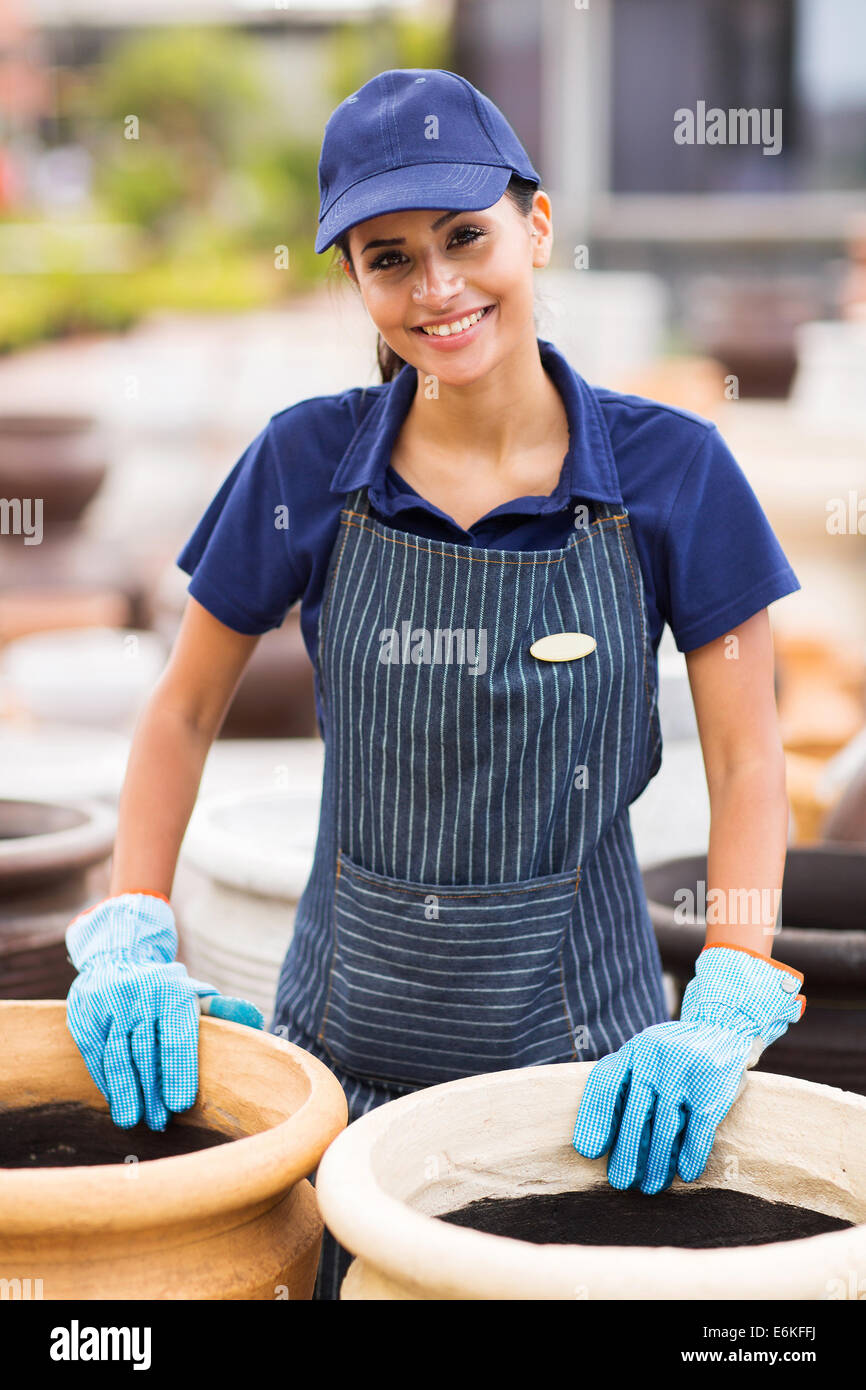 pretty female worker at home and garden store Stock Photo - Alamy
