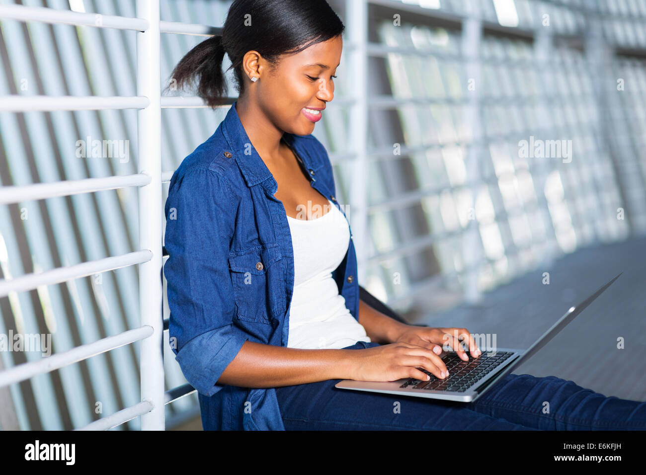 happy African American woman using laptop computer Stock Photo - Alamy