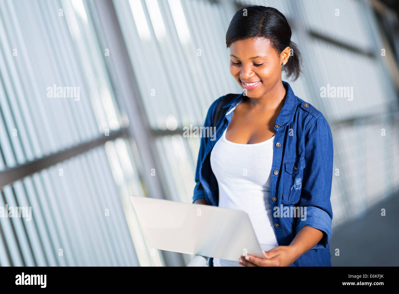 smart female African college student using laptop computer Stock Photo ...