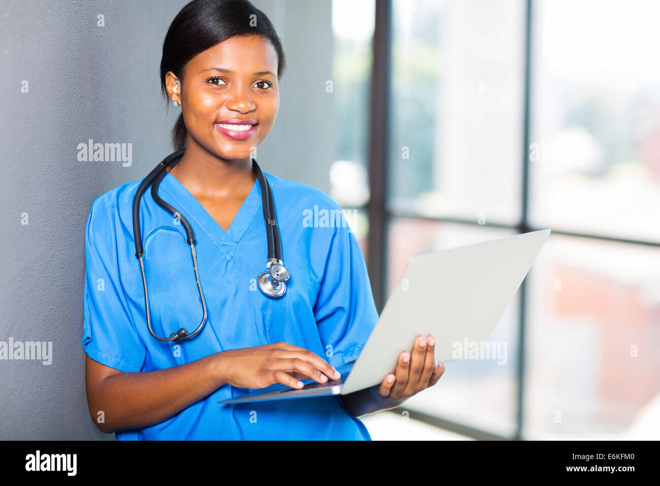 cute African healthcare worker using laptop at work Stock Photo - Alamy