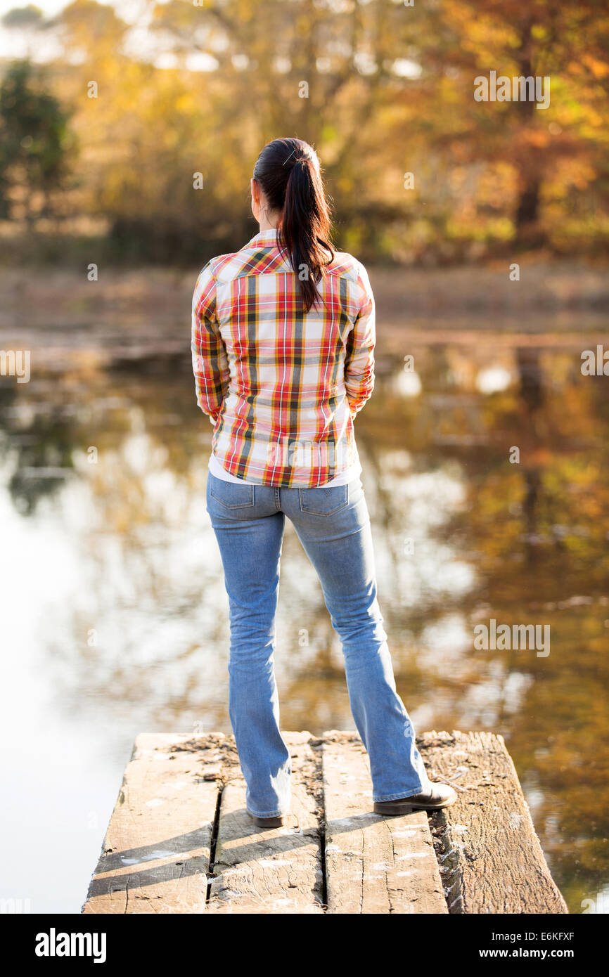 Woman standing back in full outside hi-res stock photography and images ...