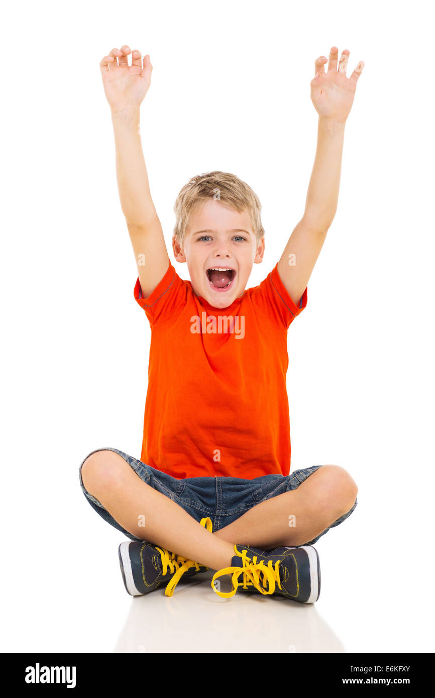 happy little boy sitting on floor and arms up Stock Photo - Alamy