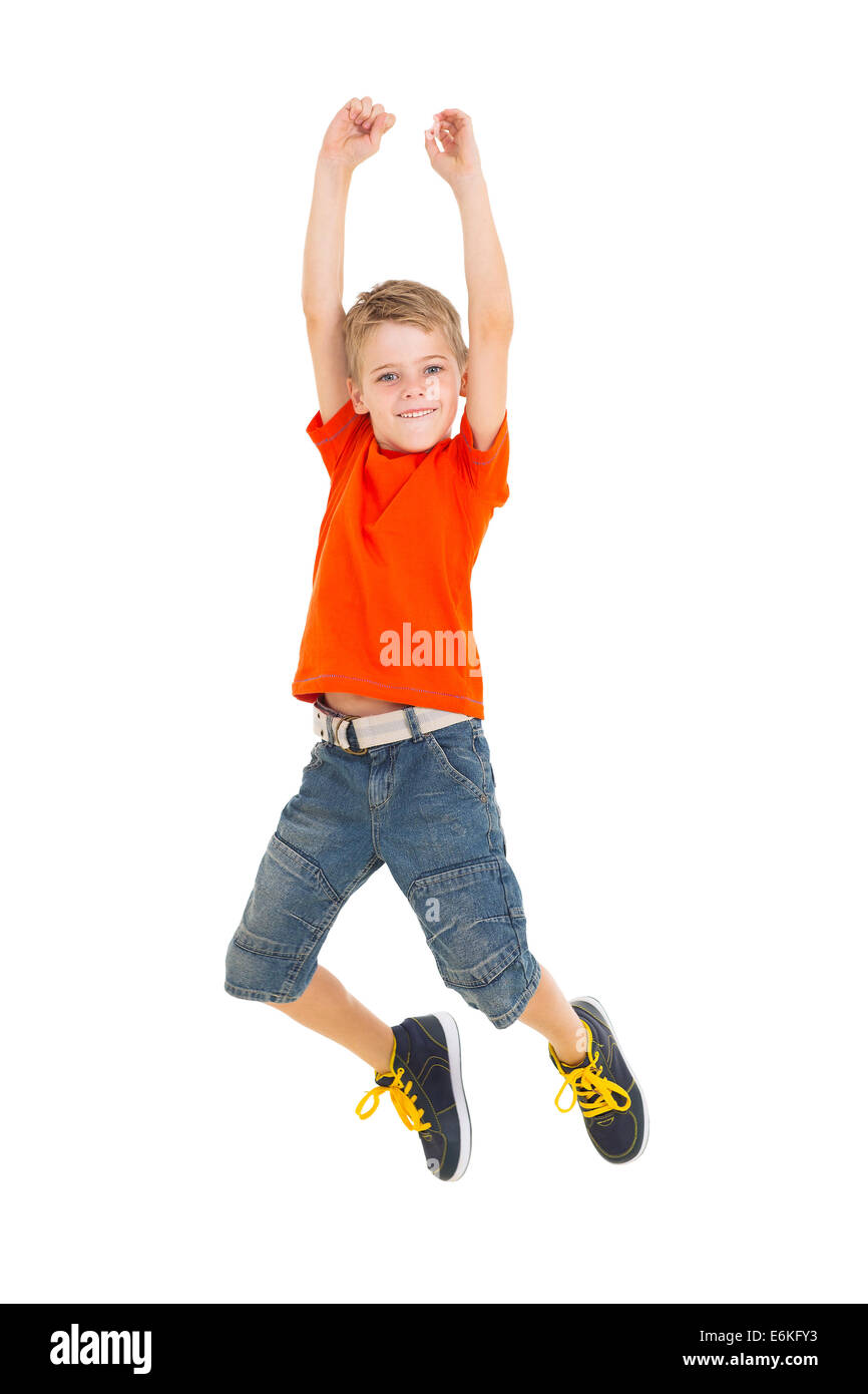 cheerful little boy jumping on white background Stock Photo - Alamy