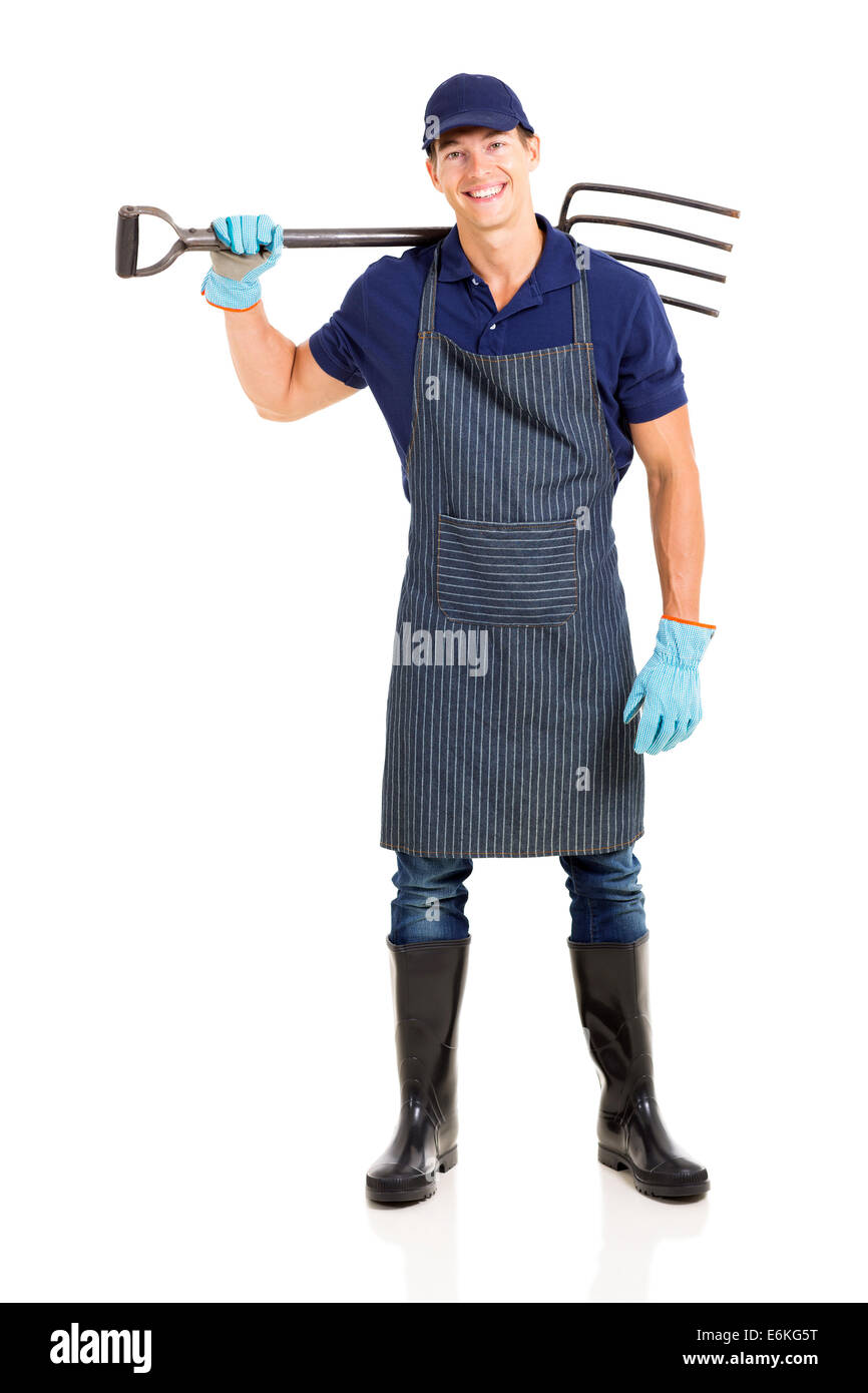 young farmer carrying a garden fork isolated on white background Stock ...